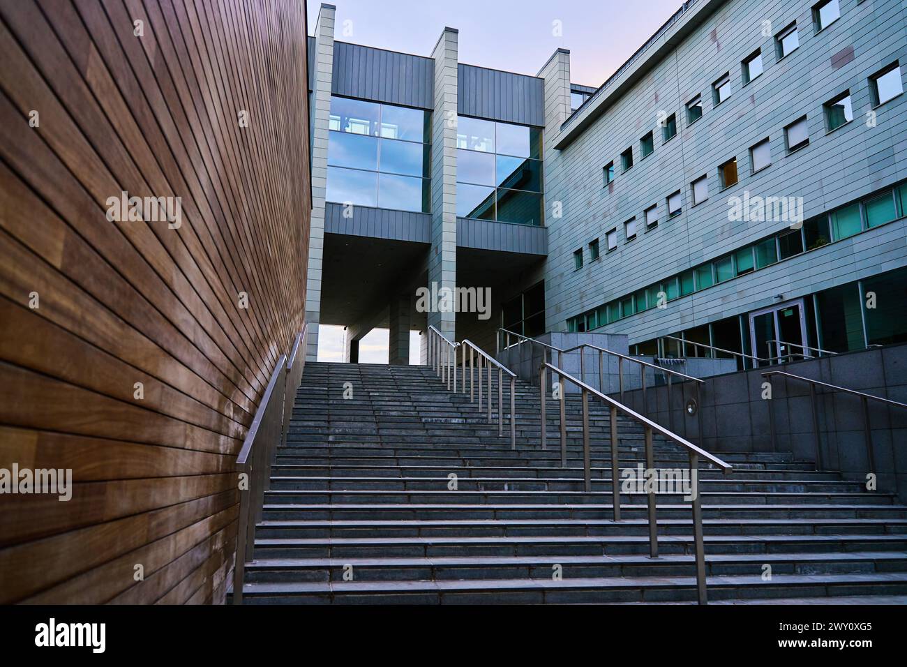 Public space in the city. Modern building with stairs and handrails ...