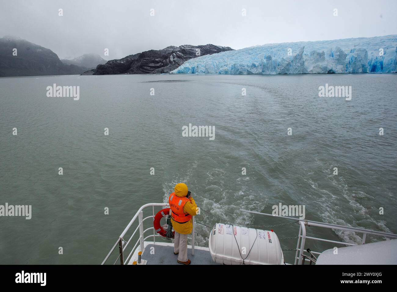 Tourists in the Grey III ferry take photos of the Grey Glacier while ...