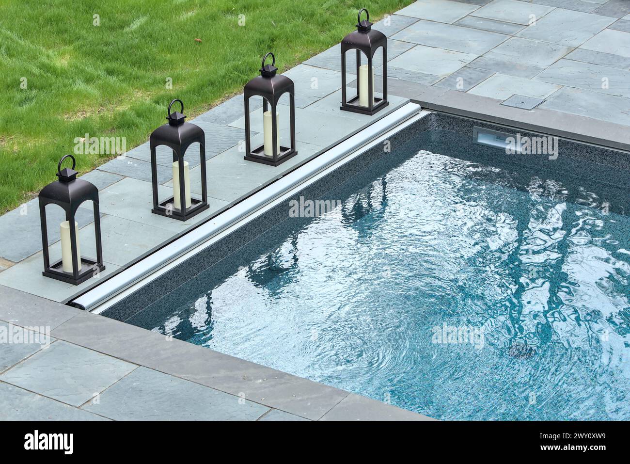 outdoor pool detail (backyard swimming pool with candle holder lanterns ...