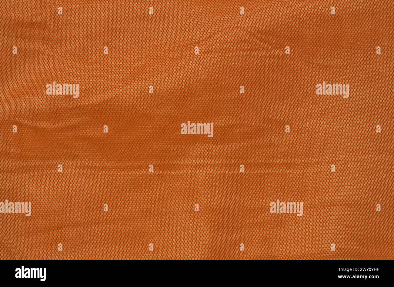 orange crumpled fabric texture background (fine mesh fabric with ...
