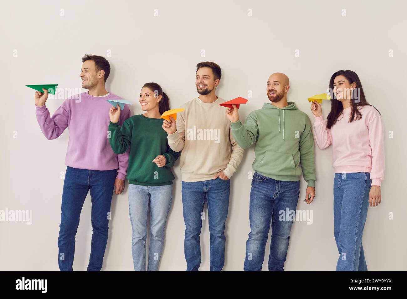 Young people holding paper hi-res stock photography and images - Alamy