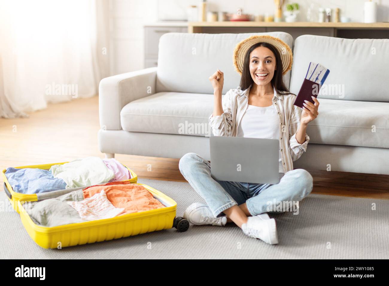 Woman holding passport and boarding pass at home Stock Photo - Alamy