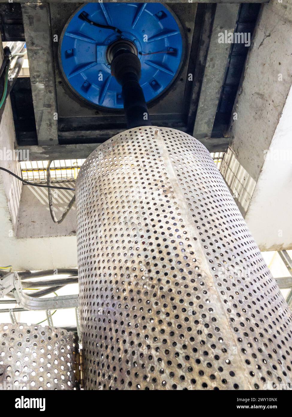 Closeup of the vertical axis of the large pumps in the water supply ...