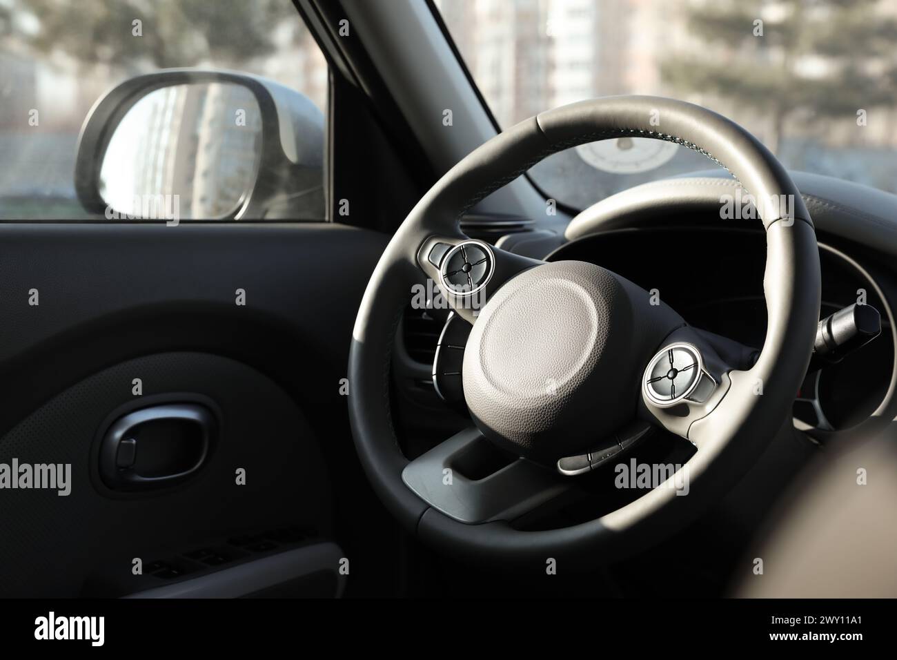 Black steering wheel inside of modern car Stock Photo - Alamy