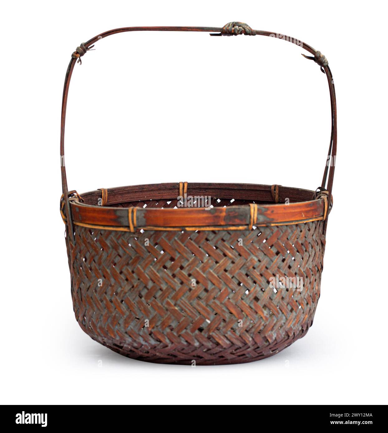 Old handmade Spanish wicker basket isolated on white background with ...