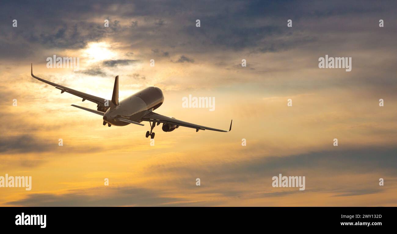 Airplane. Landscape with big white passenger airplane is flying in the ...