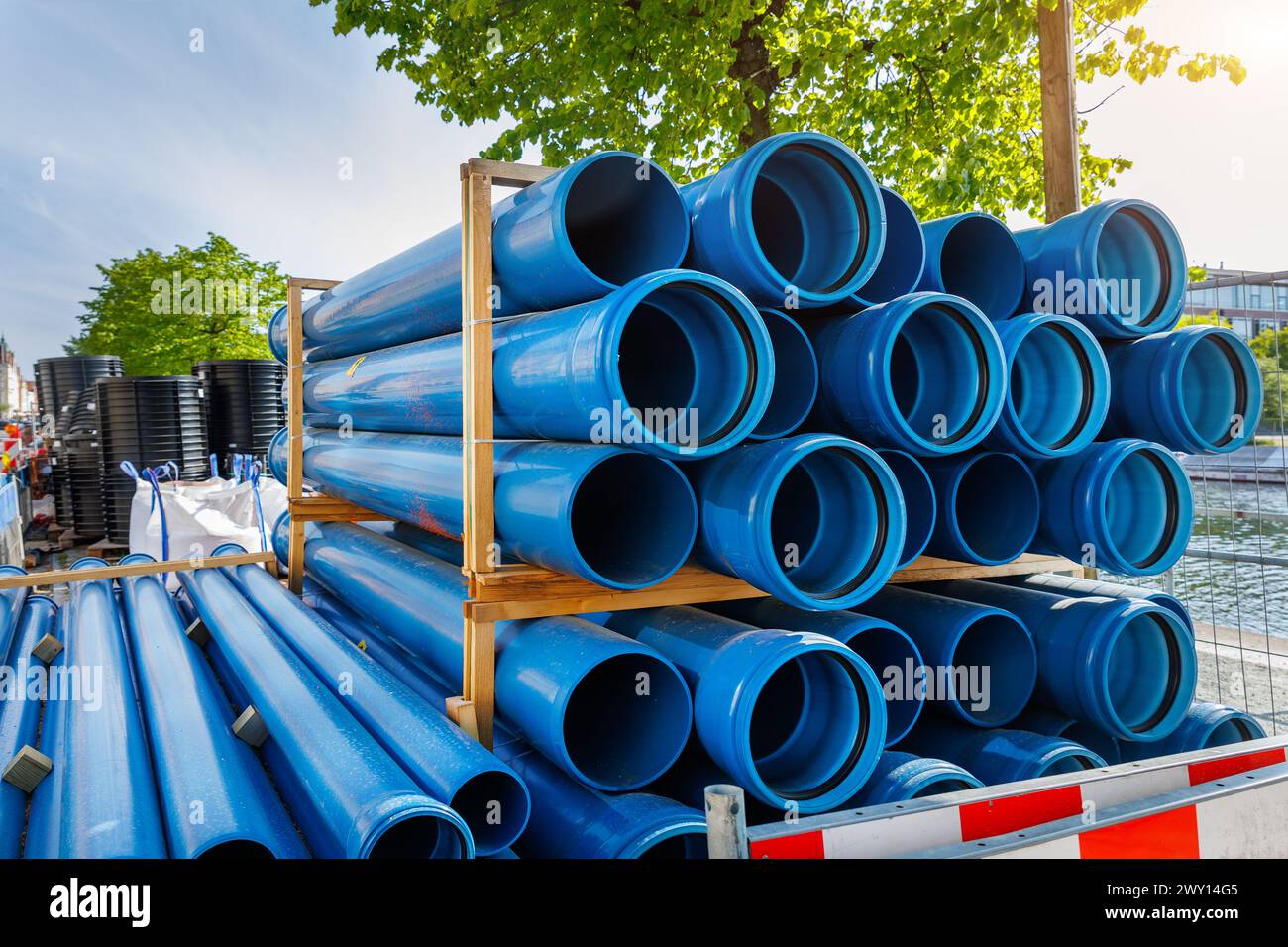 Close-up blue PVC plumbing pipes stacked wooden pallets replacement at ...