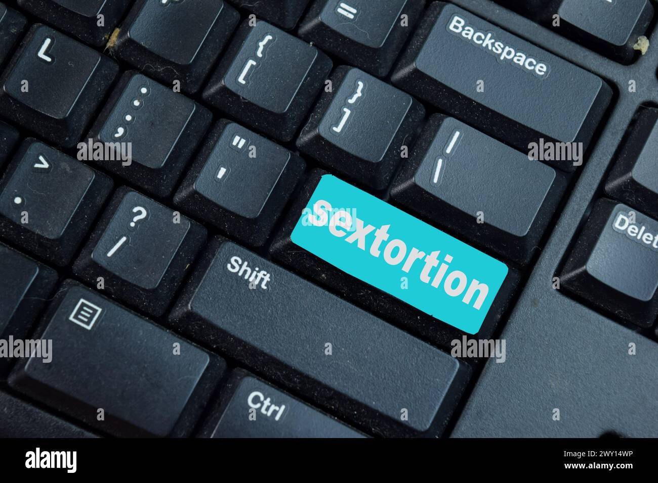 Sextortion write on keyword isolated laptop background Stock Photo - Alamy