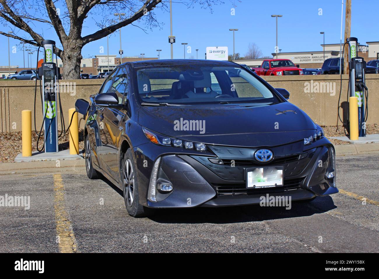 Toyota Electric Car Charging on evergy charger outdoors in parking lot ...