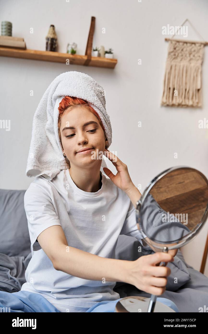 appealing extravagant person with white hair towel looking in mirror ...
