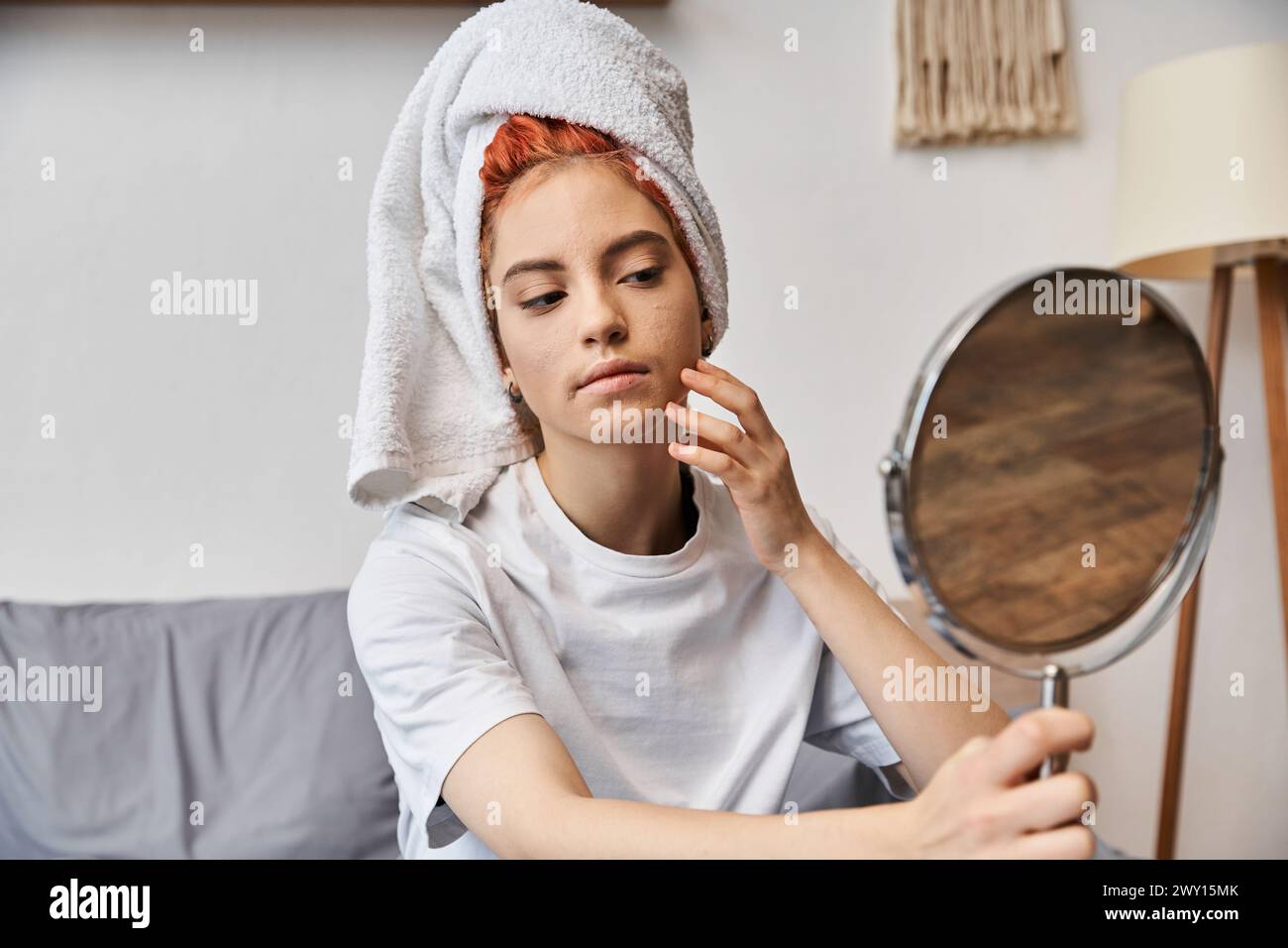 appealing extravagant person with white hair towel looking in mirror ...