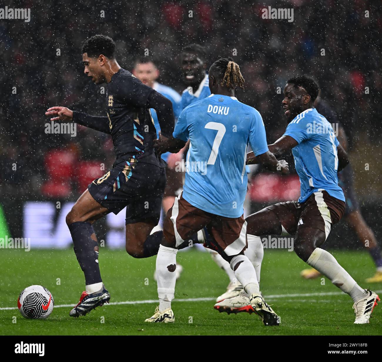 LONDON, ENGLAND - MARCH 26: Jude Bellingham, Jeremy Doku in action ...