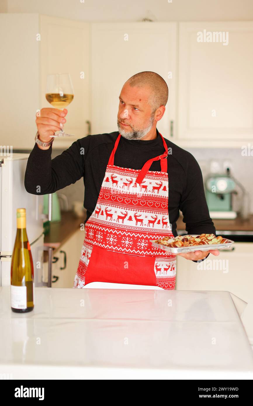 male chef preparing french snail food and tastes French wine Stock ...