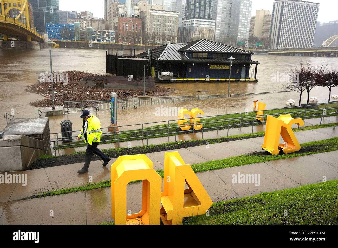 The Northshore riverwalk outside PNC Park in Pittsburgh is flooded by ...