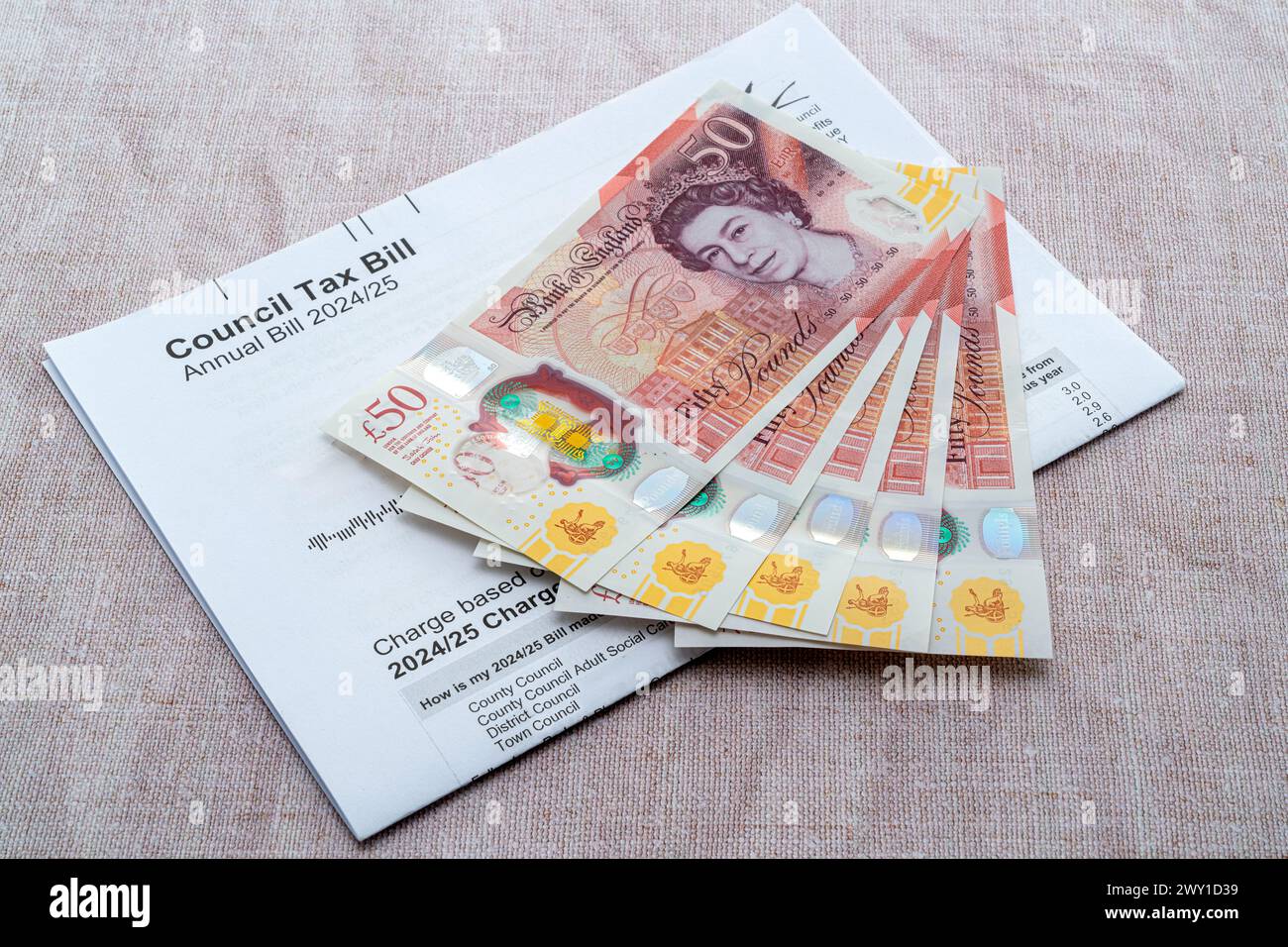 UK Council Tax Bill for 2024/25 with fifty pound notes Stock Photo - Alamy