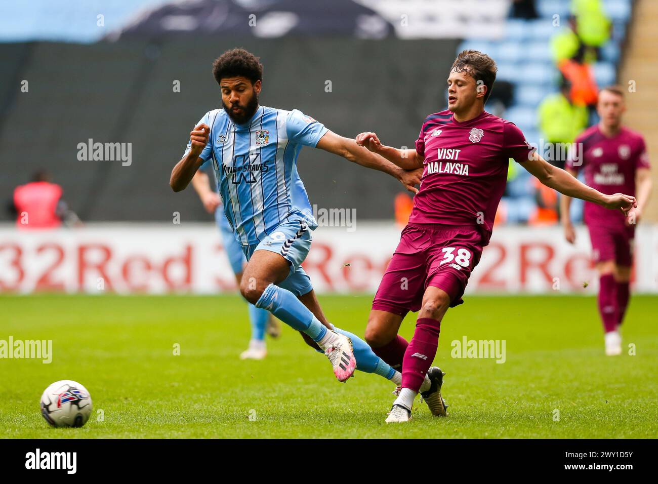 Coventry City's Ellis Simms and Cardiff City's Perry Ng battle for the ...