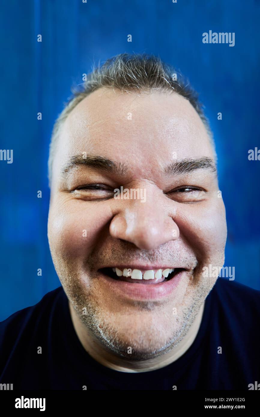 Full-mouth smile, close-up of face of large Caucasian man with wide ...