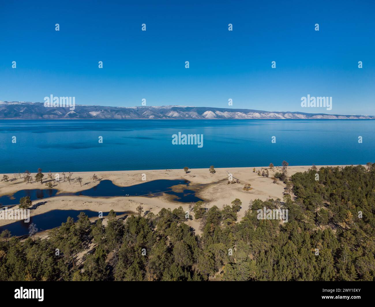 Sarayskiy beach. Shamanka Rock. Lake Baikal at Olkhon Island. the ...