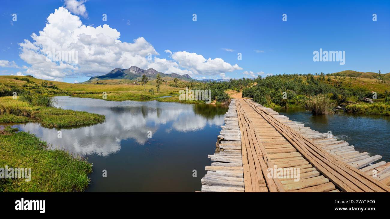 River flowing under wooden bridge near Sendrisoa as seen during trek to ...