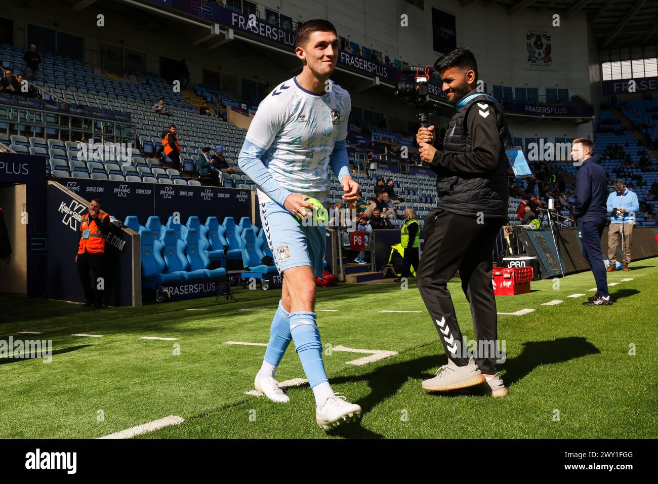Coventry City's Bobby Thomas makes his way out for the pre-match warm ...