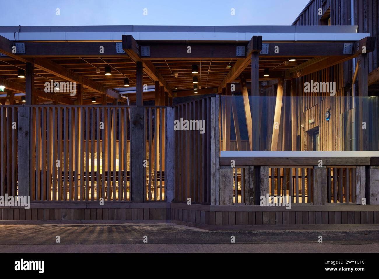 Exterior view from beach at dusk. Durley Chine Environmental Hub ...