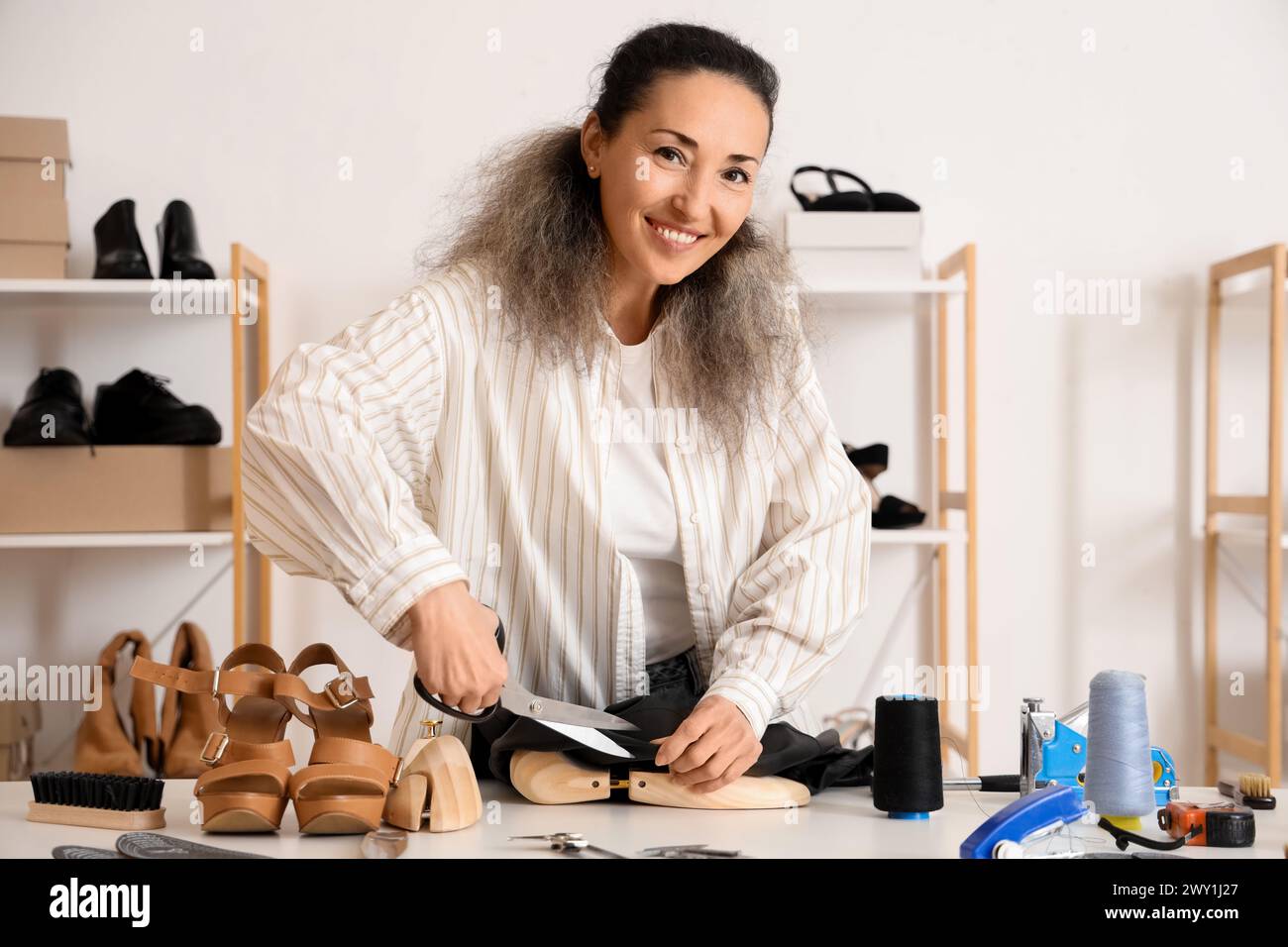 Female shoemaker wooden shoe hi-res stock photography and images - Alamy