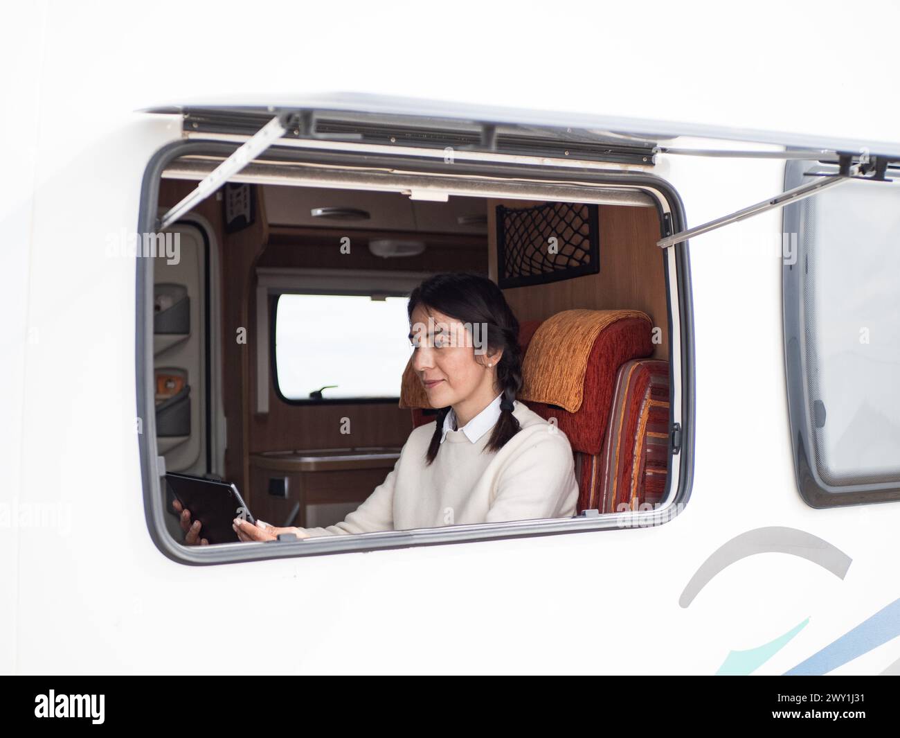 Woman inside camper van hi-res stock photography and images - Alamy