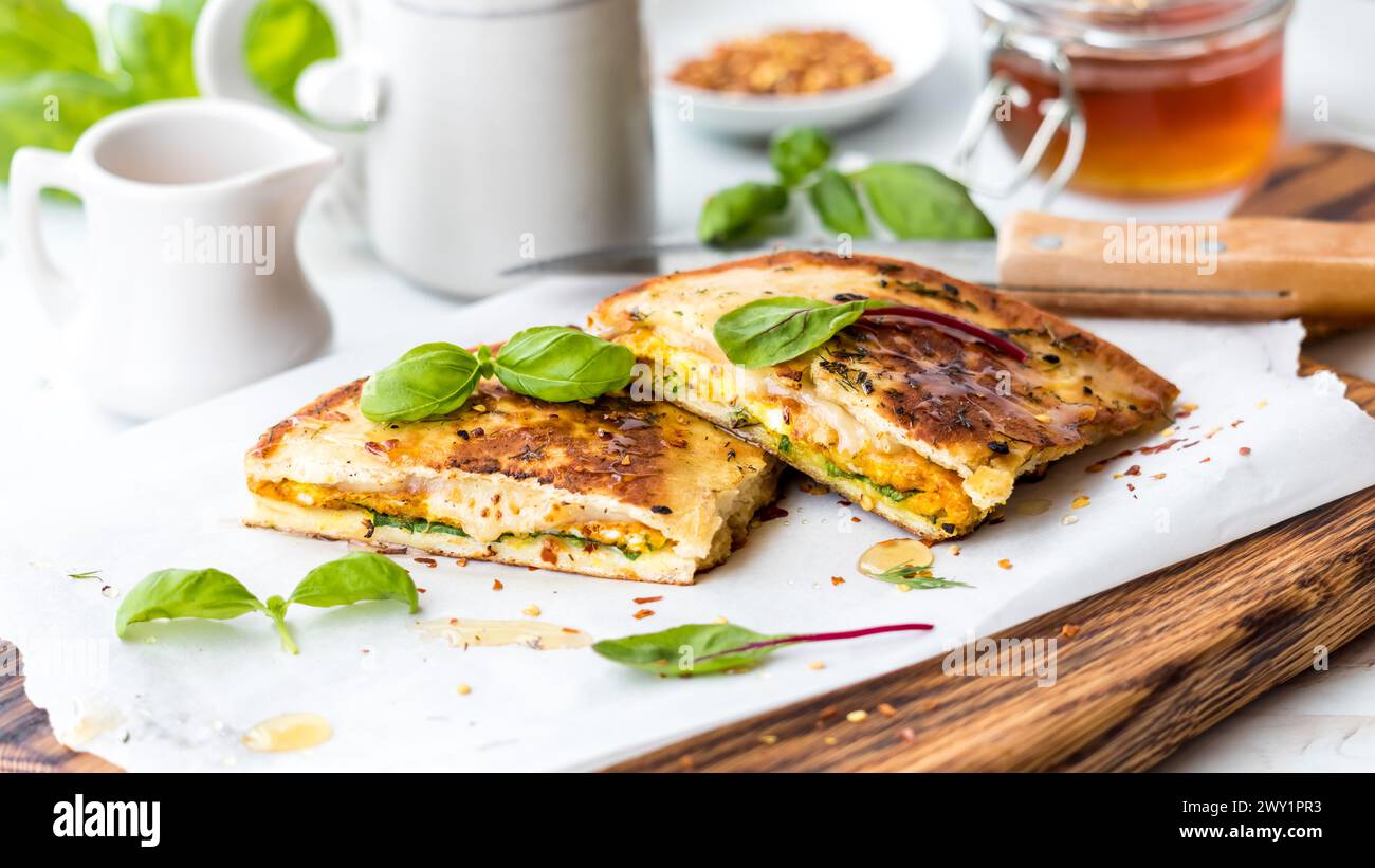 Naan bread with egg and melted gouda cheese breakfast sandwiches Stock ...