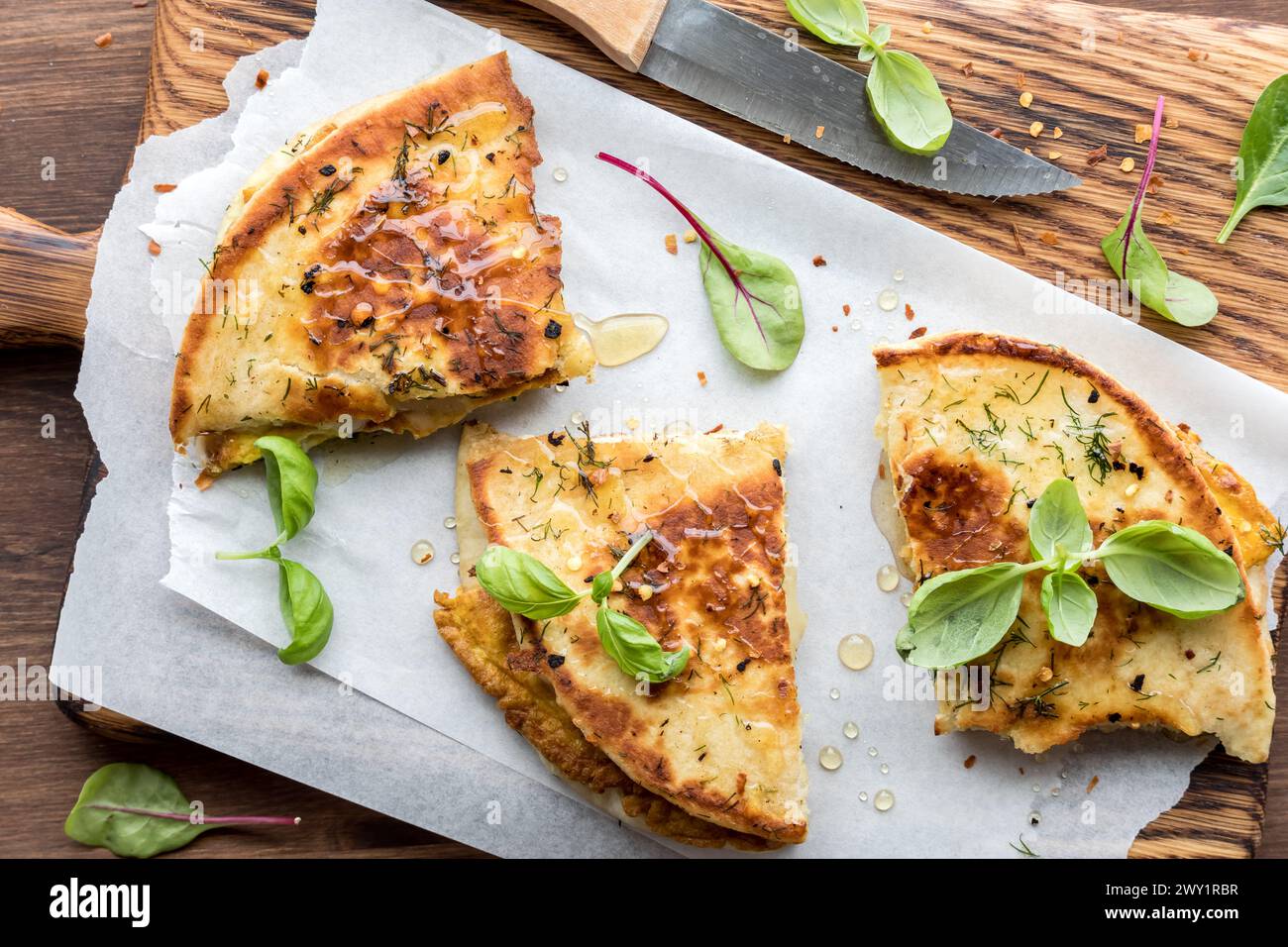 Naan bread breakfast sandwiches with herbs and honey Stock Photo - Alamy