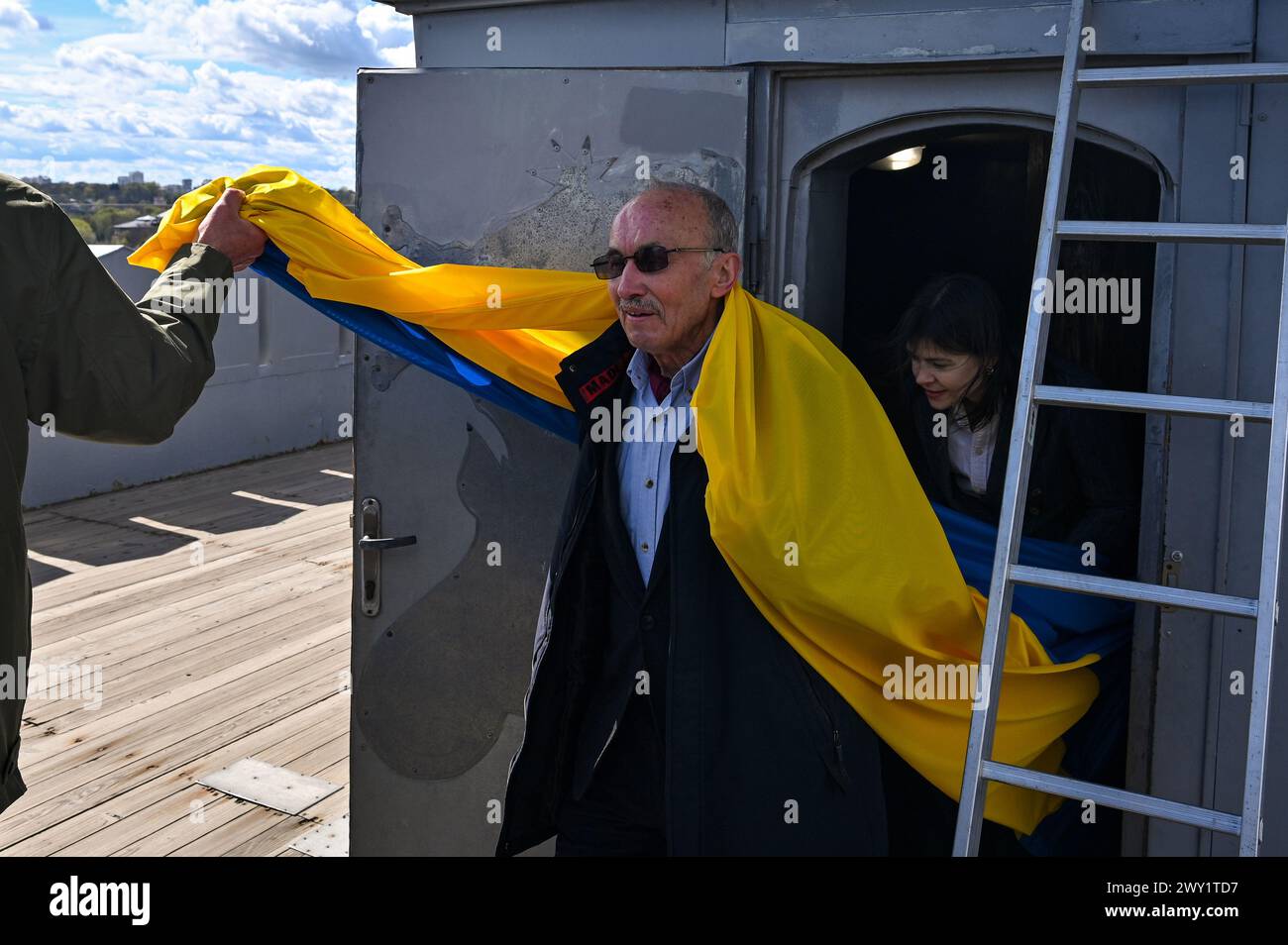 LVIV, UKRAINE - APRIL 3, 2024 - People bring a blue and yellow national ...