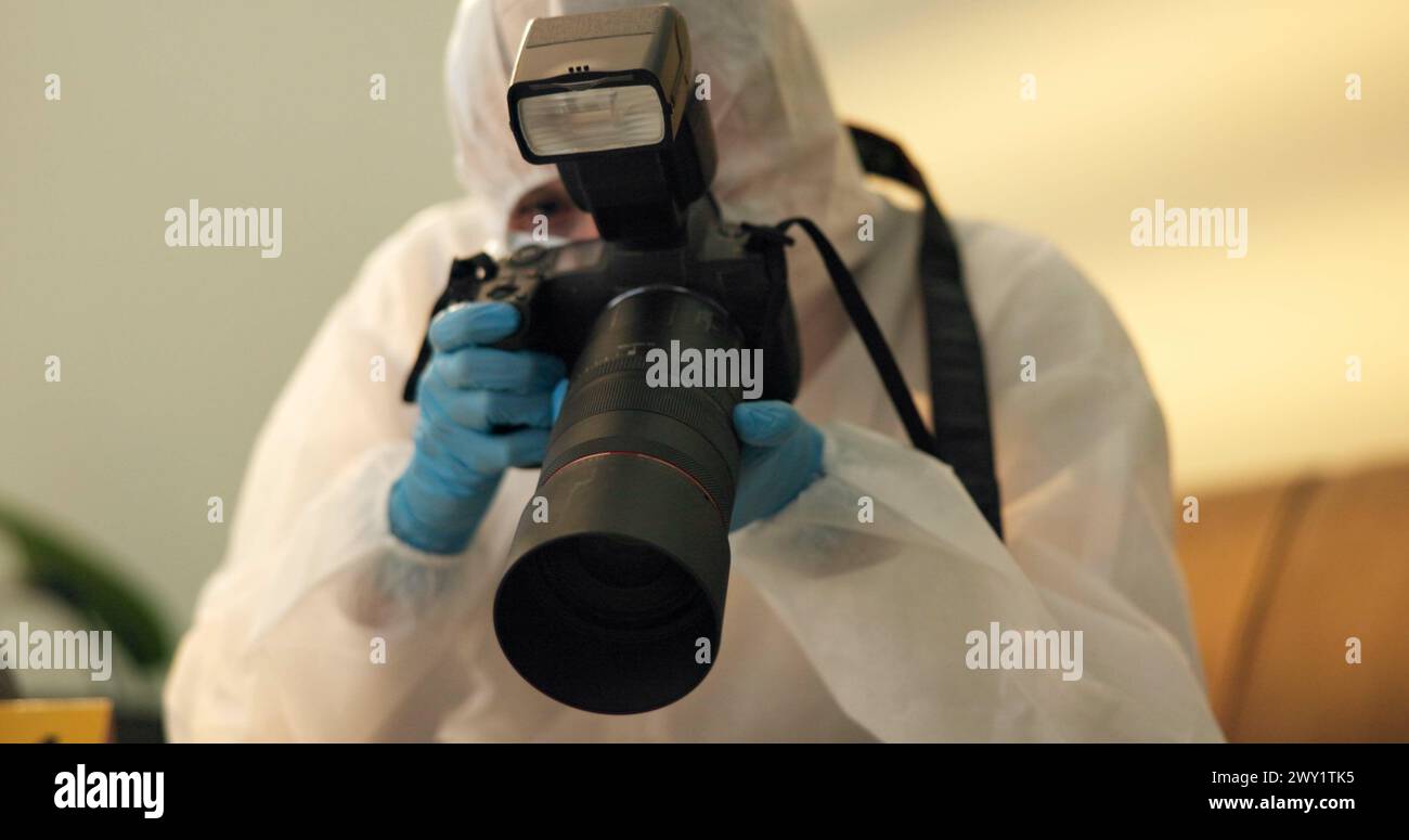 Forensic, photographer and csi at crime scene for investigation of house burglary or murder ...