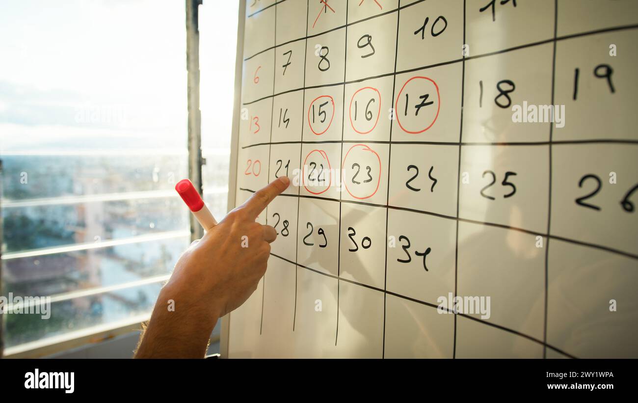 Marking Dates On A Calendar board Stock Photo - Alamy