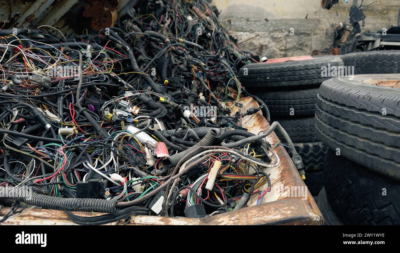 electrical cables to be recycled piled up in landfill Stock Photo - Alamy