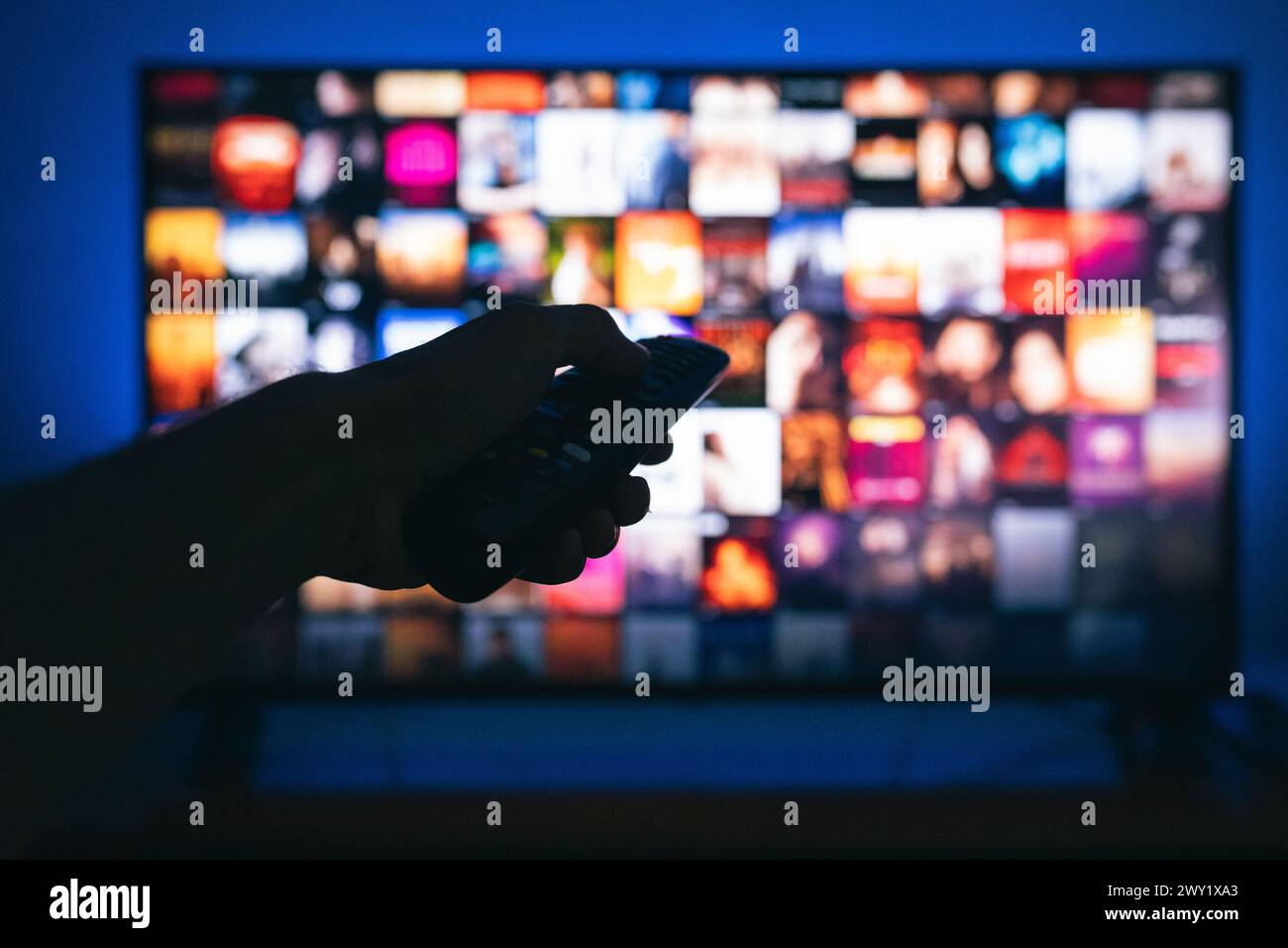 Remote control pointing at a TV Stock Photo - Alamy