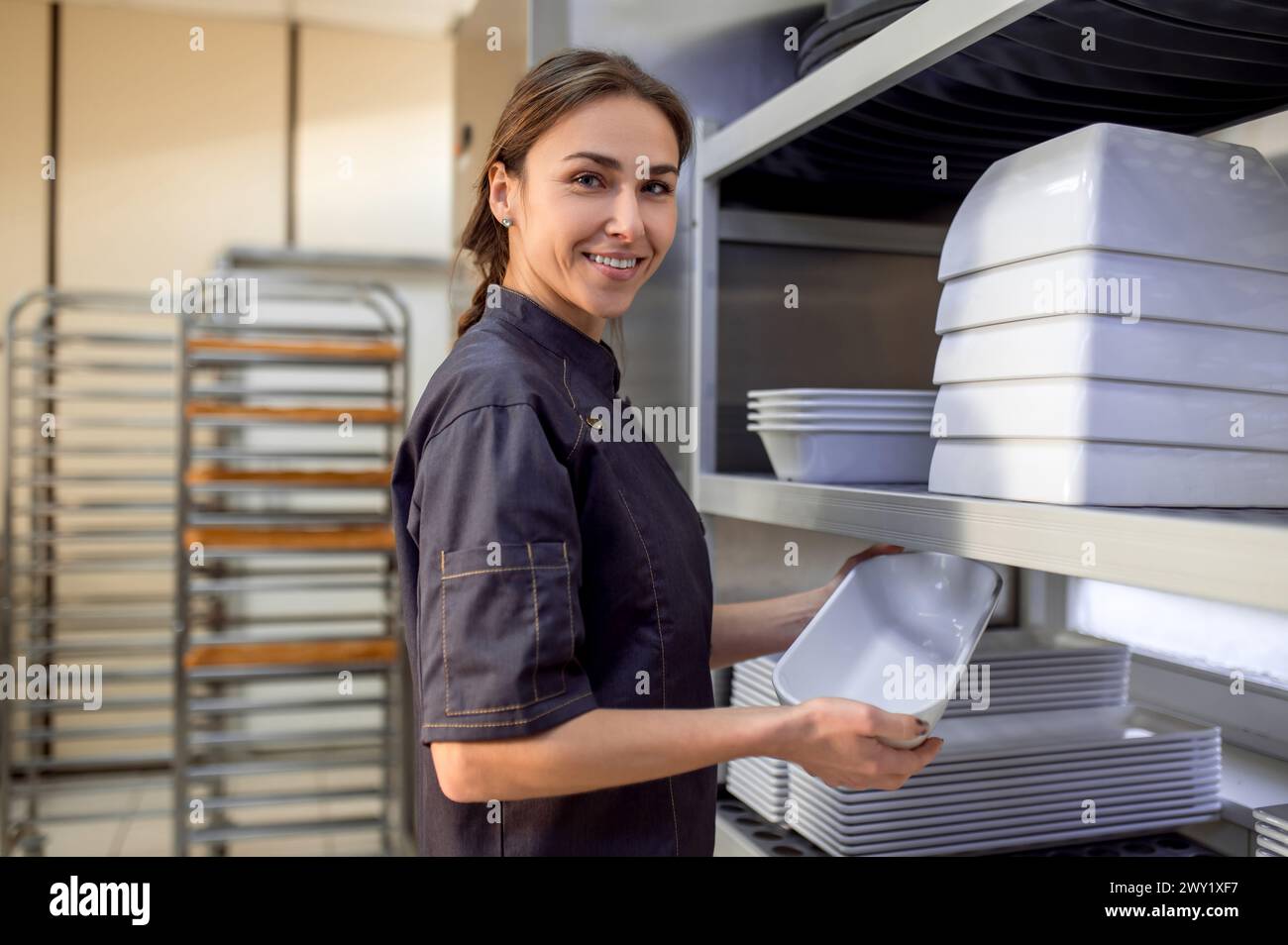 Woman professional baker posing at her workplace Stock Photo - Alamy