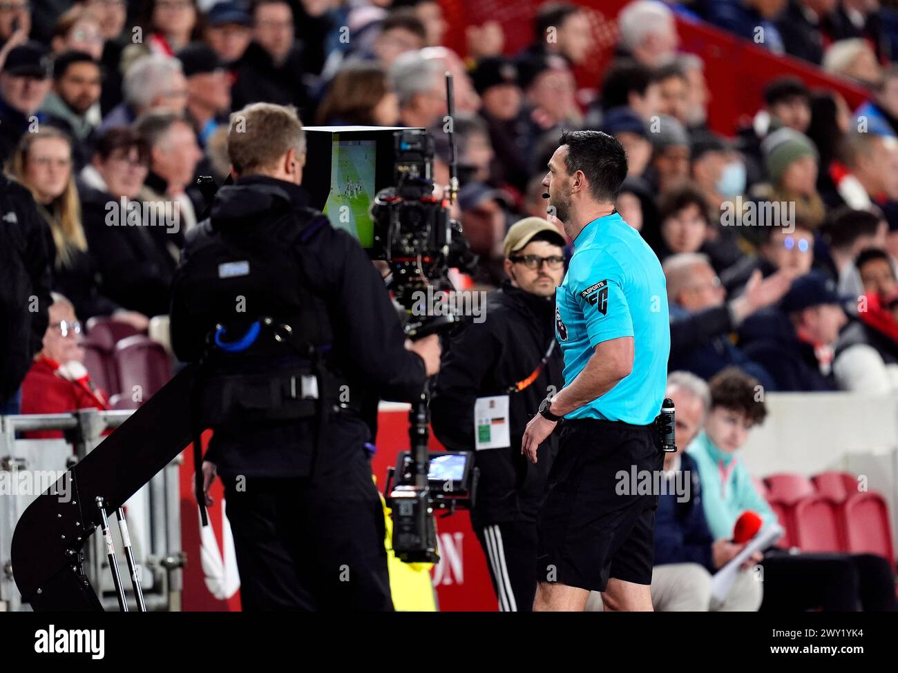 Referee Andrew Madley checks the pitch side VAR monitor for a potential ...