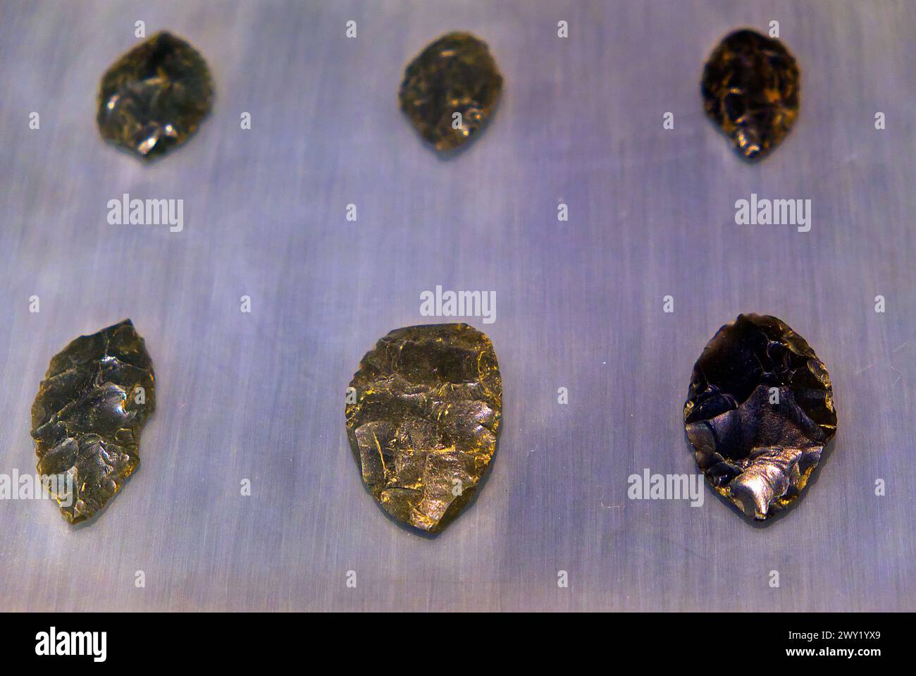 Neolithic obsidian arrowhead on dark background Stock Photo - Alamy