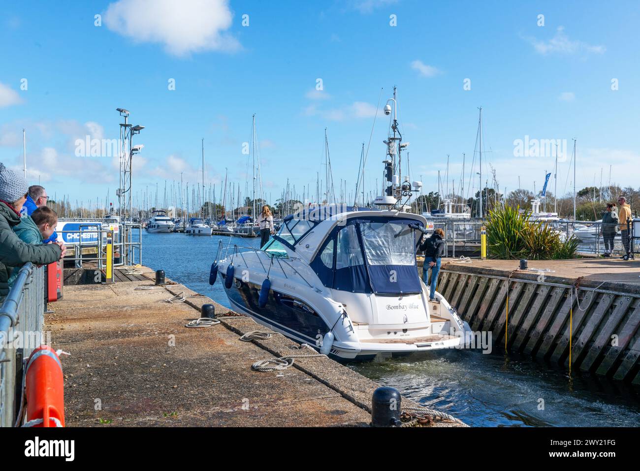 Motor yacht leaving Chichester Yacht Marina lock gates after reaching ...