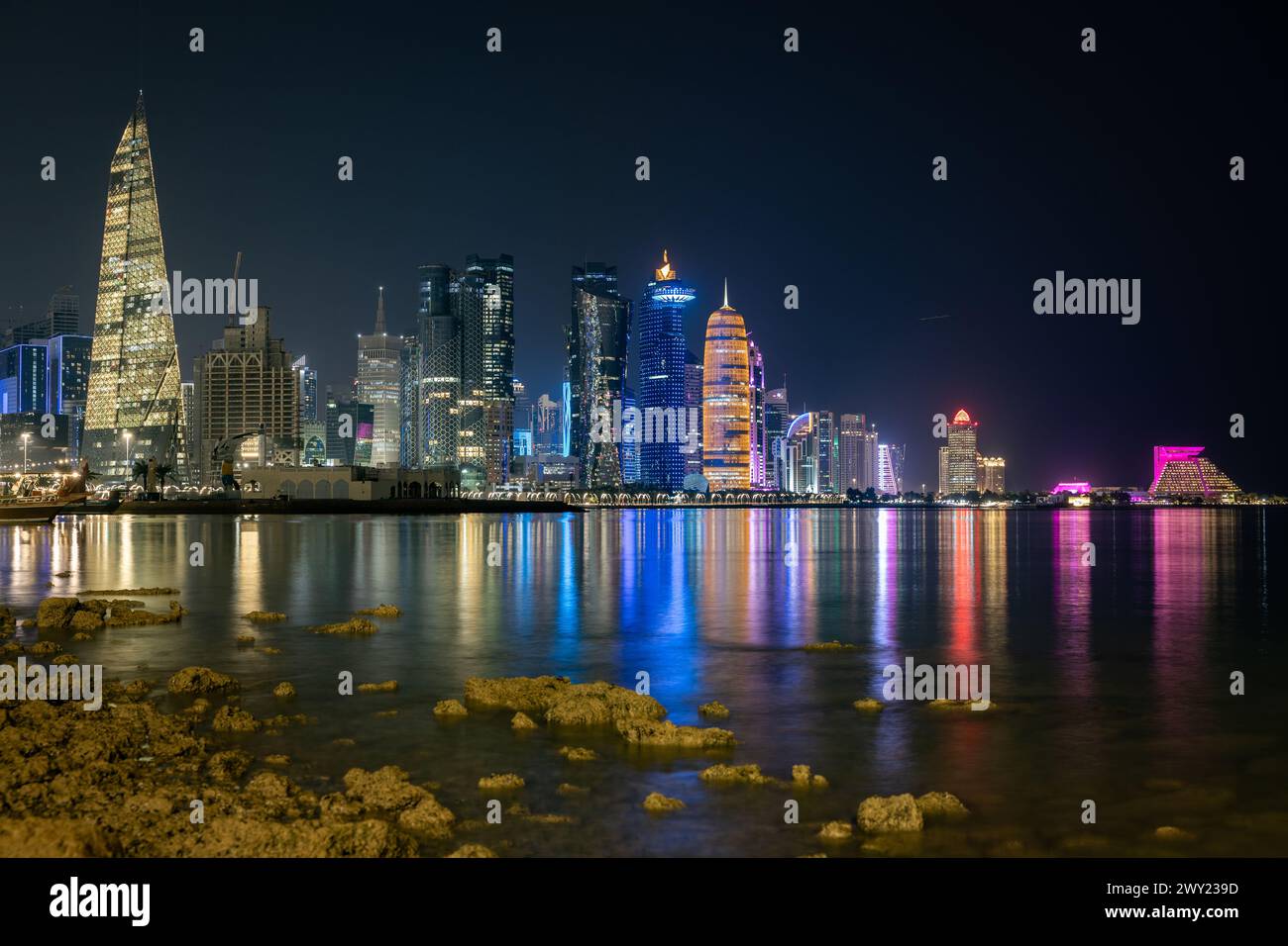 Doha night city skyline illuminated at night. Qatar, Middle East ...