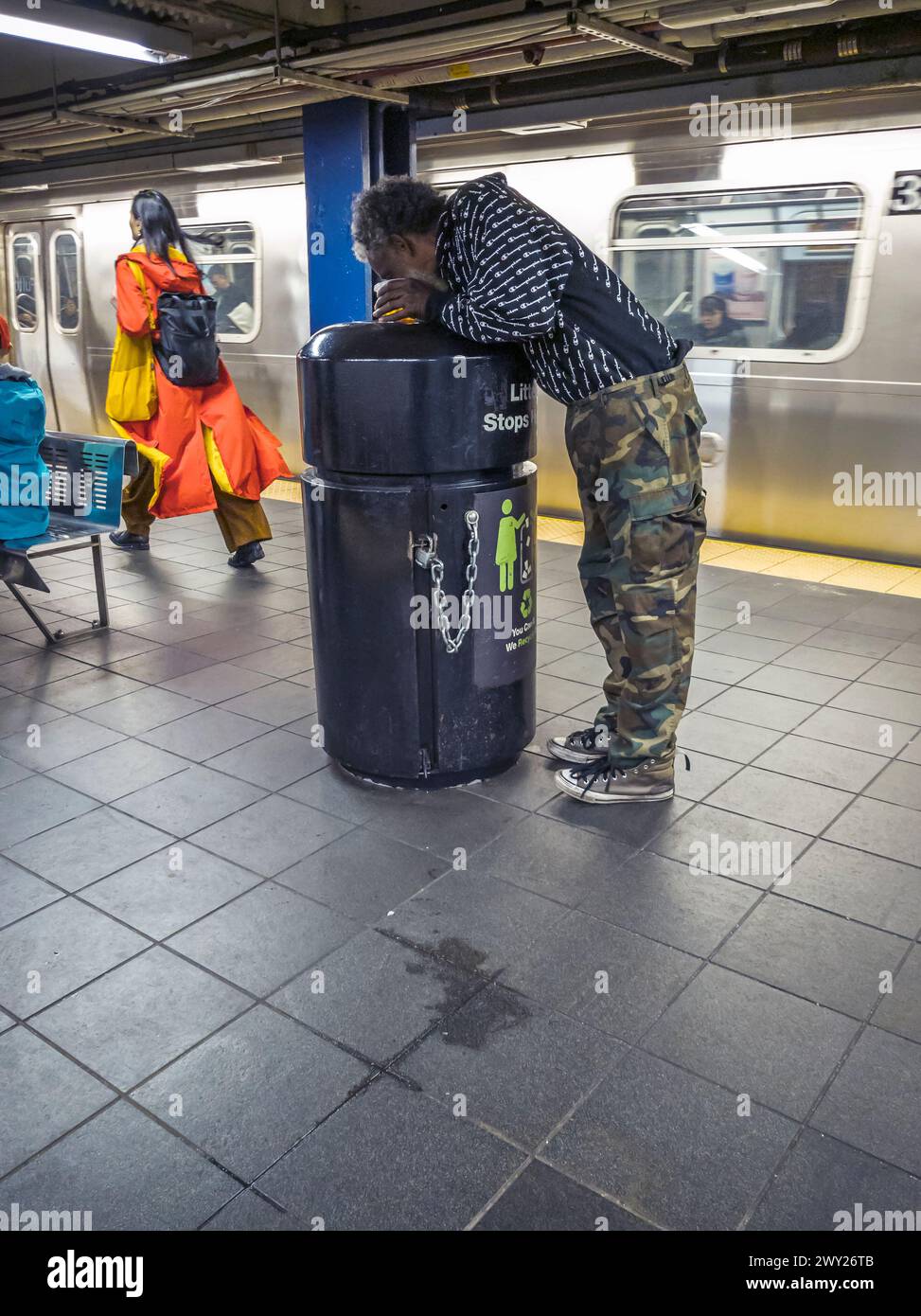 Rummaging through a garbage can hi-res stock photography and images - Alamy