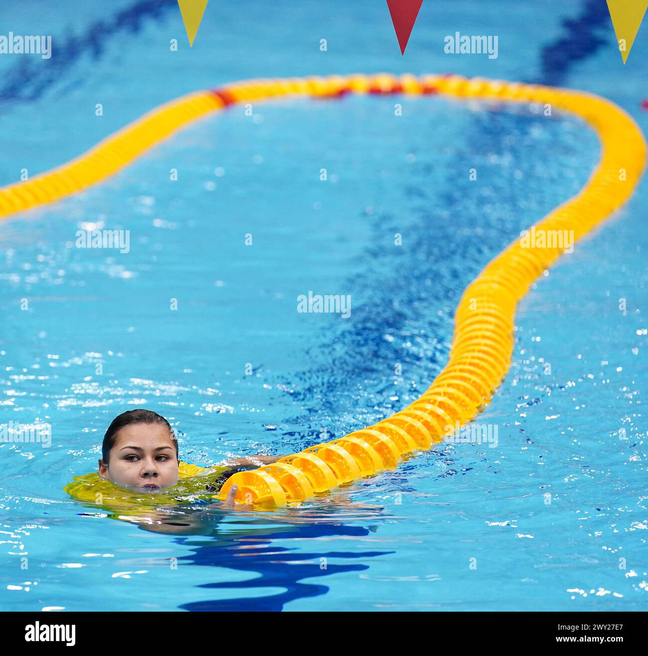 A lifeguard attempts to rescue a lane rope during day two of the 2024 ...