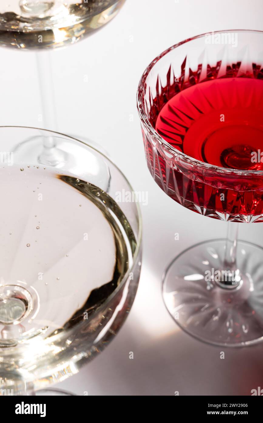 Still life drinks in tall glasses, white background, red and yellow ...