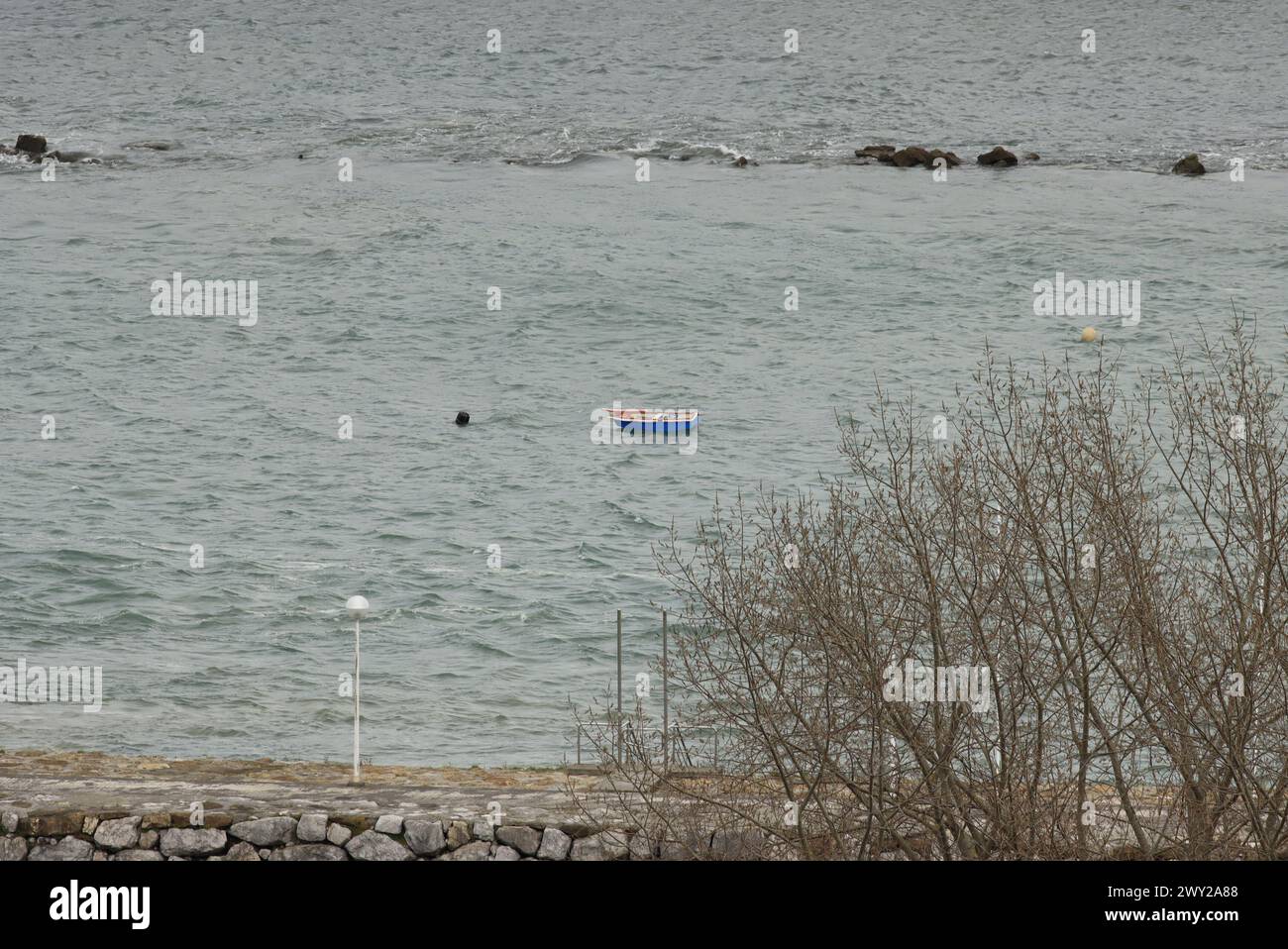 Boat floating in the sea Stock Photo - Alamy
