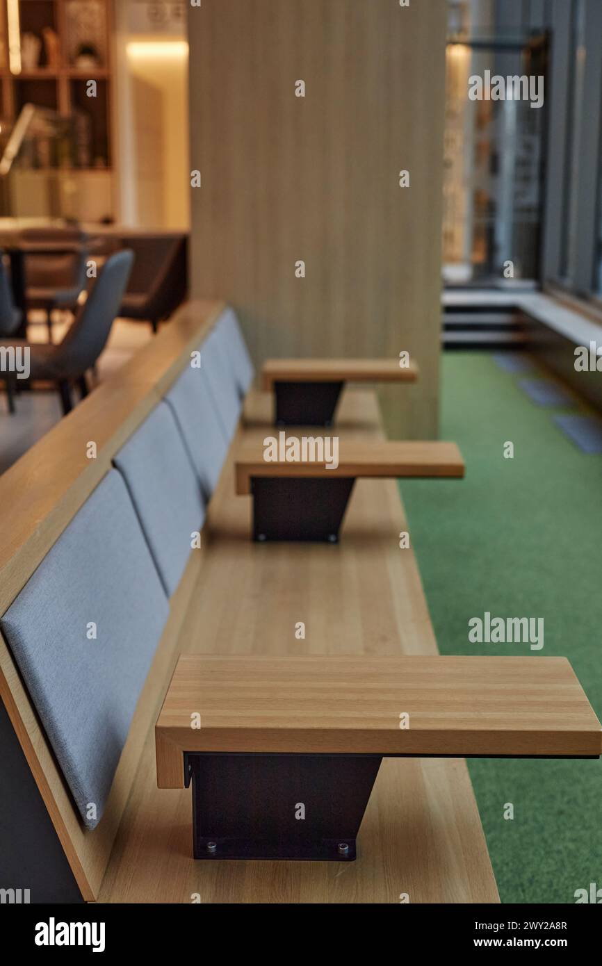 Vertical background image of seating row facing window with geometric ...