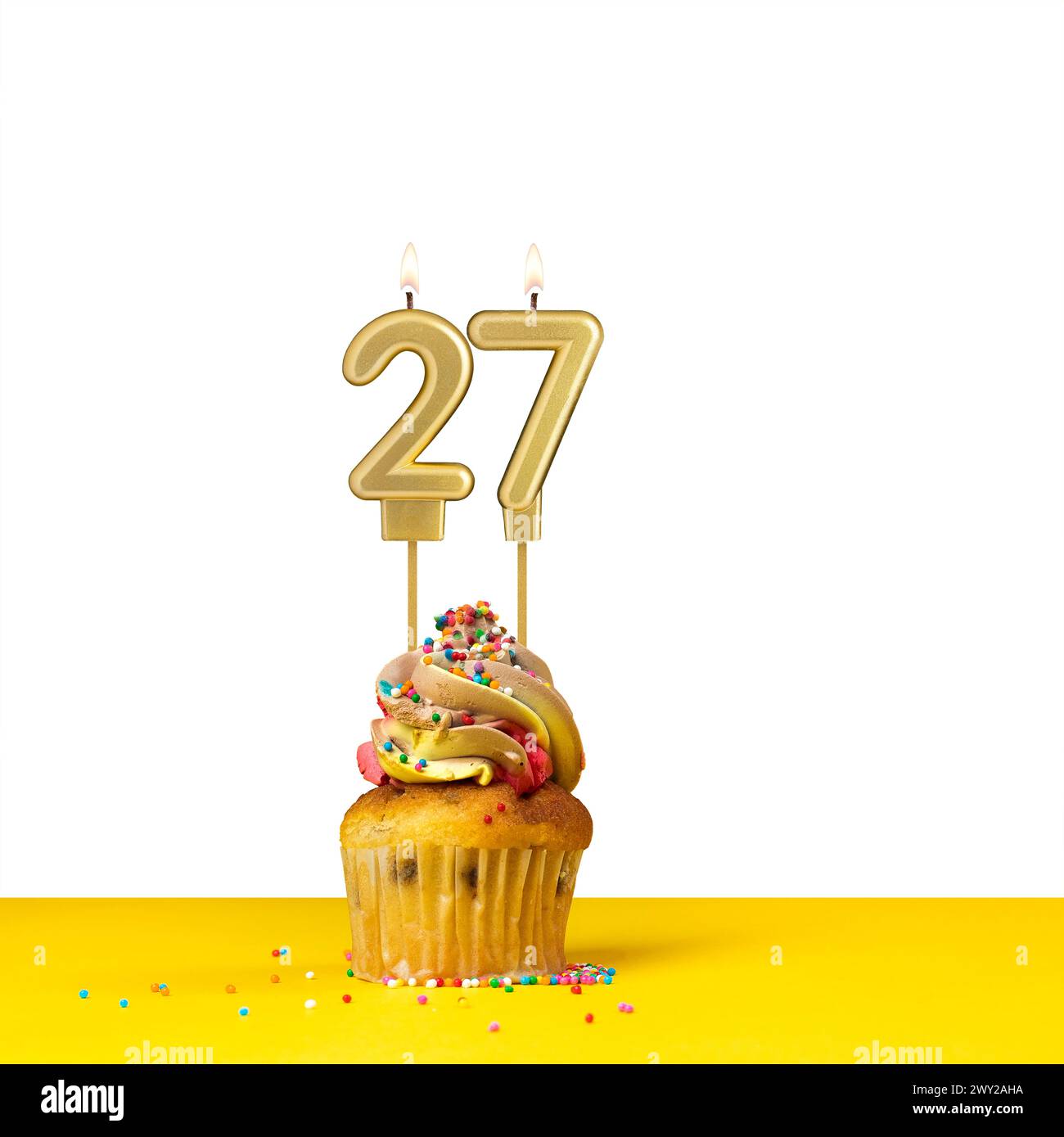 Cupcake with birthday candle - Candle number 27 Stock Photo - Alamy