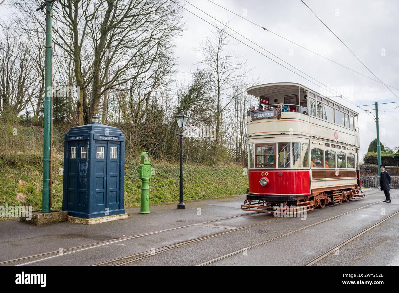A conductor waits by a tram as it waits to depart at the National ...