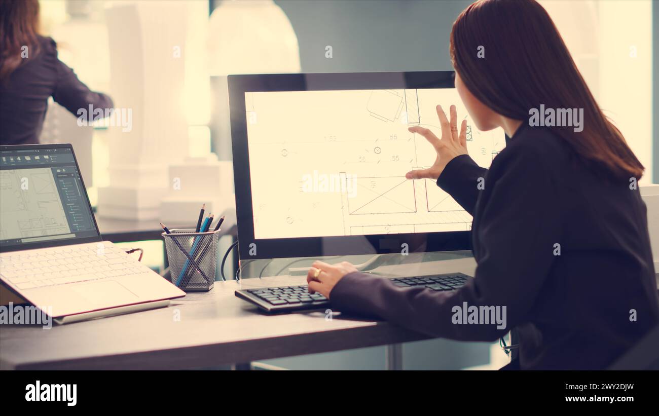 Architect designing blueprints for house remodeling project, using ...