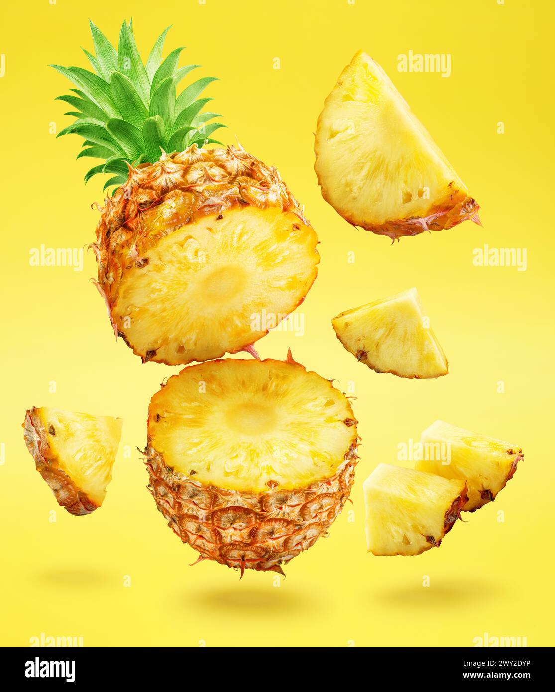 Ripe pineapple and pineapple slices isolated on white background. File ...