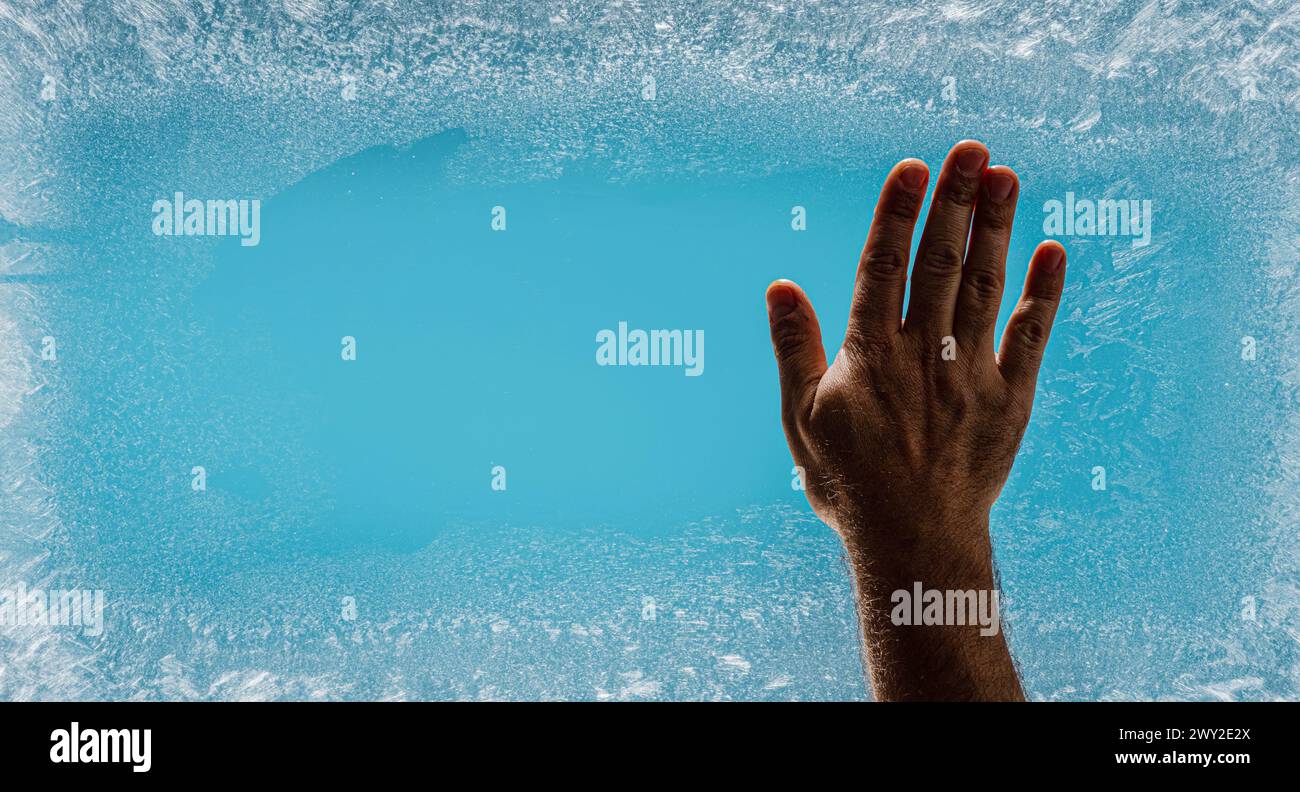 Frost patterns on frozen winter window as a symbol of Christmas wonder ...