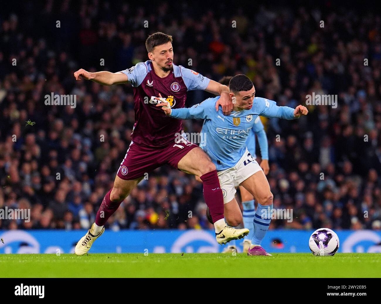 Aston Villa's Clement Lenglet (left) and Manchester City's Phil Foden ...